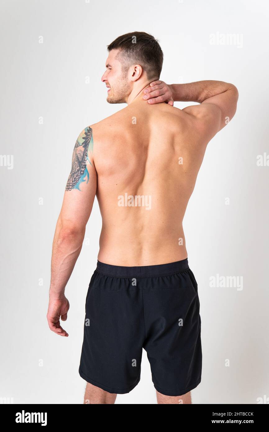 The muscles of the neck in a man on a white background are hurt pain ...
