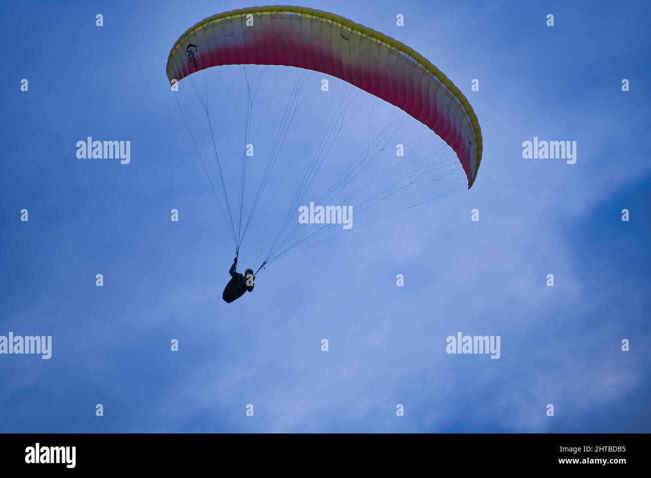 Shot of someone flying with parachute Stock Photo - Alamy