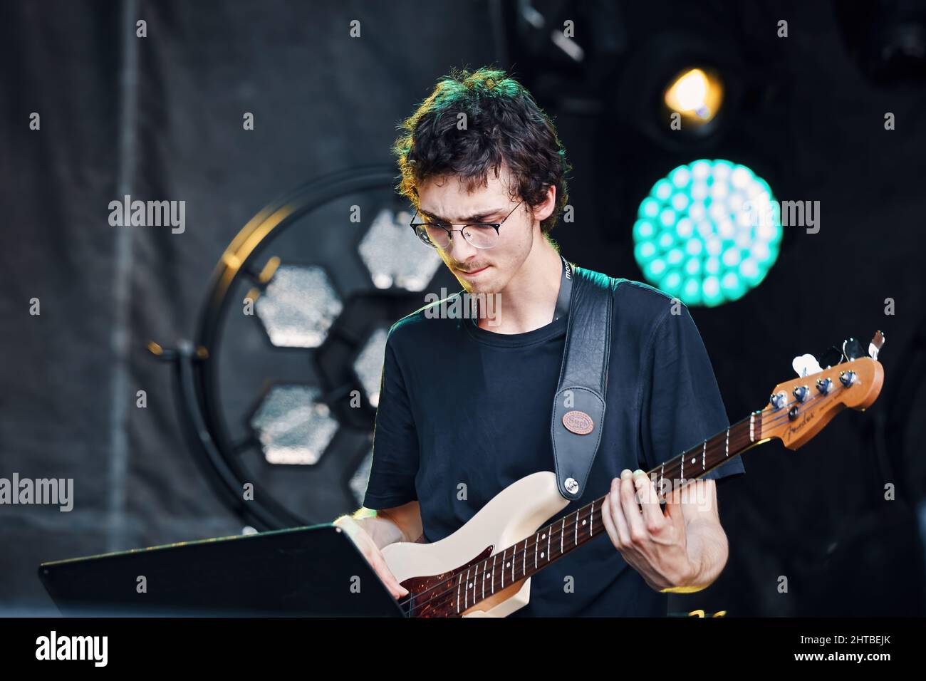 June, 2018 - Montreal, Canada: Young bass guitar player playing his ...