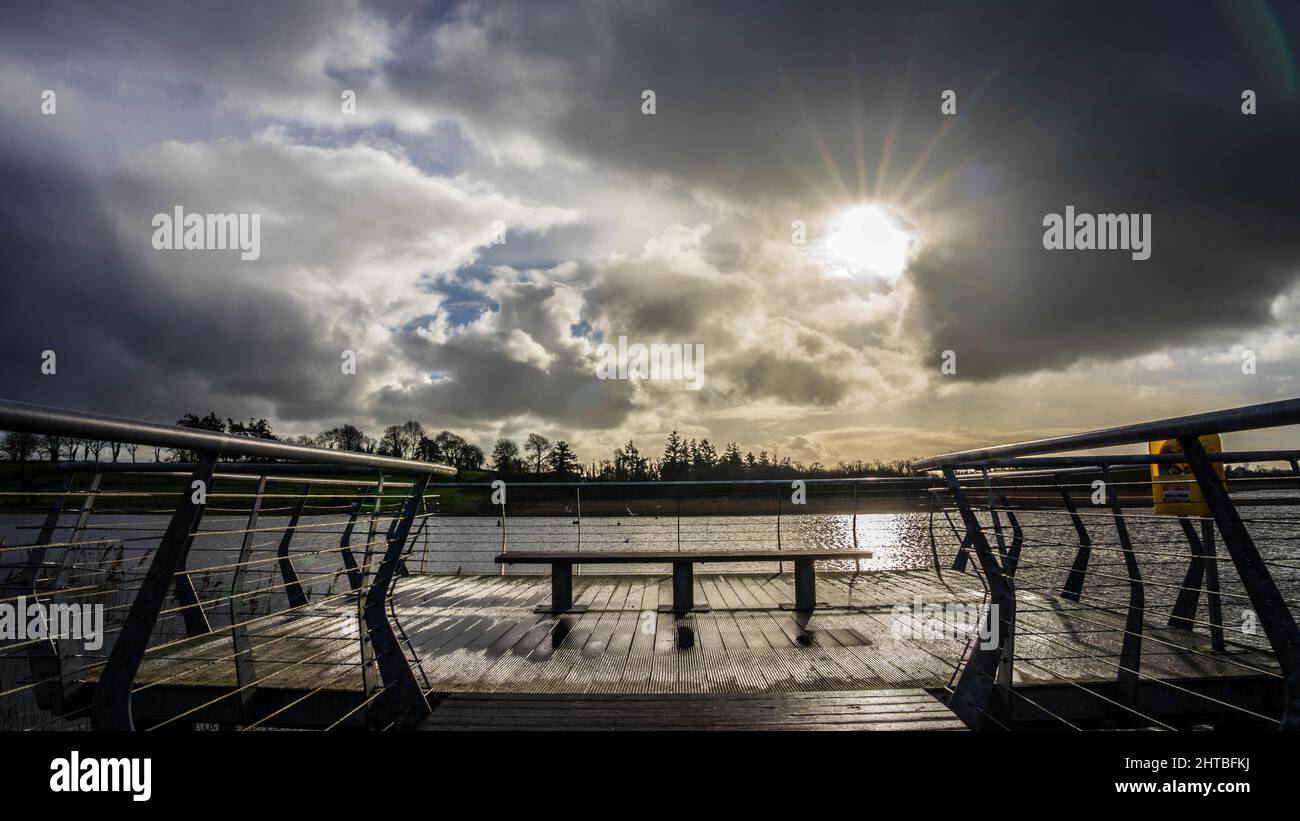 Beautiful view of the sunset and the wooden board looking at the sea on ...
