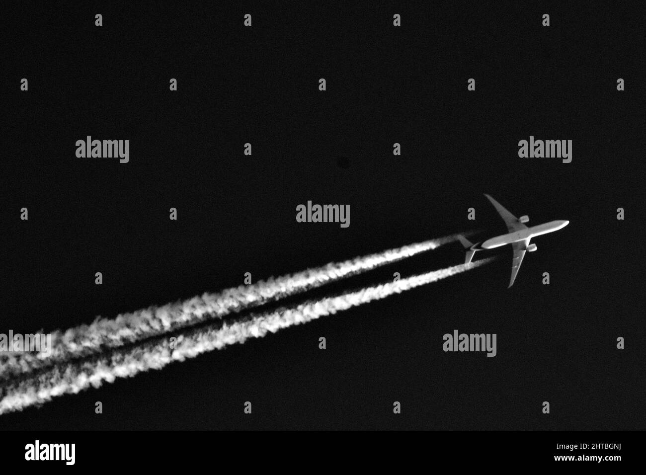Closeup of an airplane and its contrail Stock Photo - Alamy