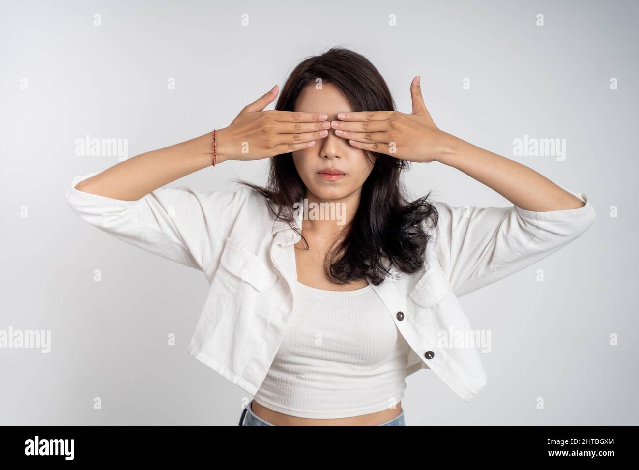 asian woman shut her eyes with hand Stock Photo - Alamy