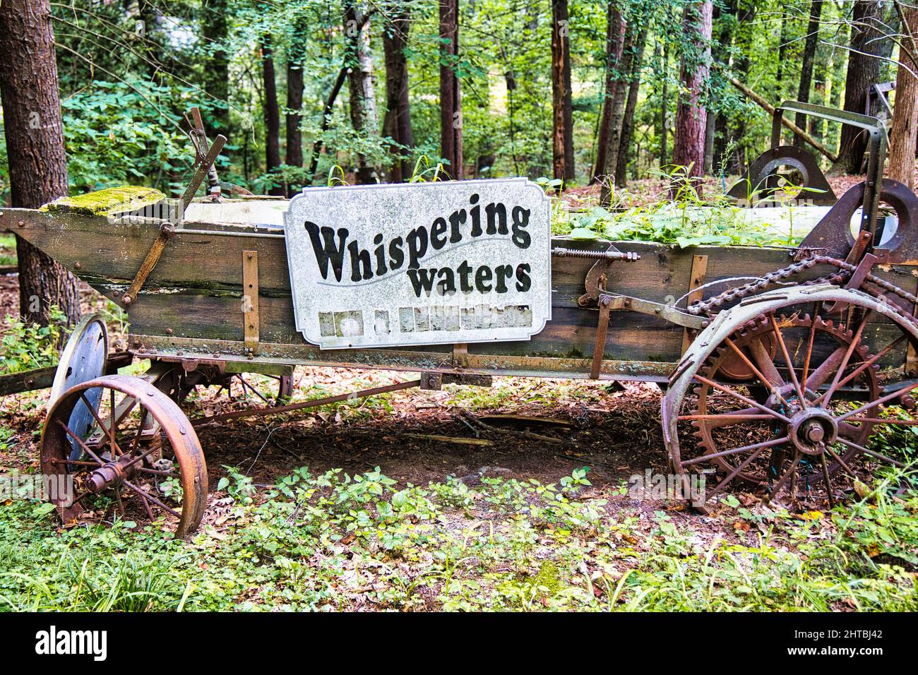 Closeup of a Whispering Waters sign on an old wagon by Wisconsin Dells ...