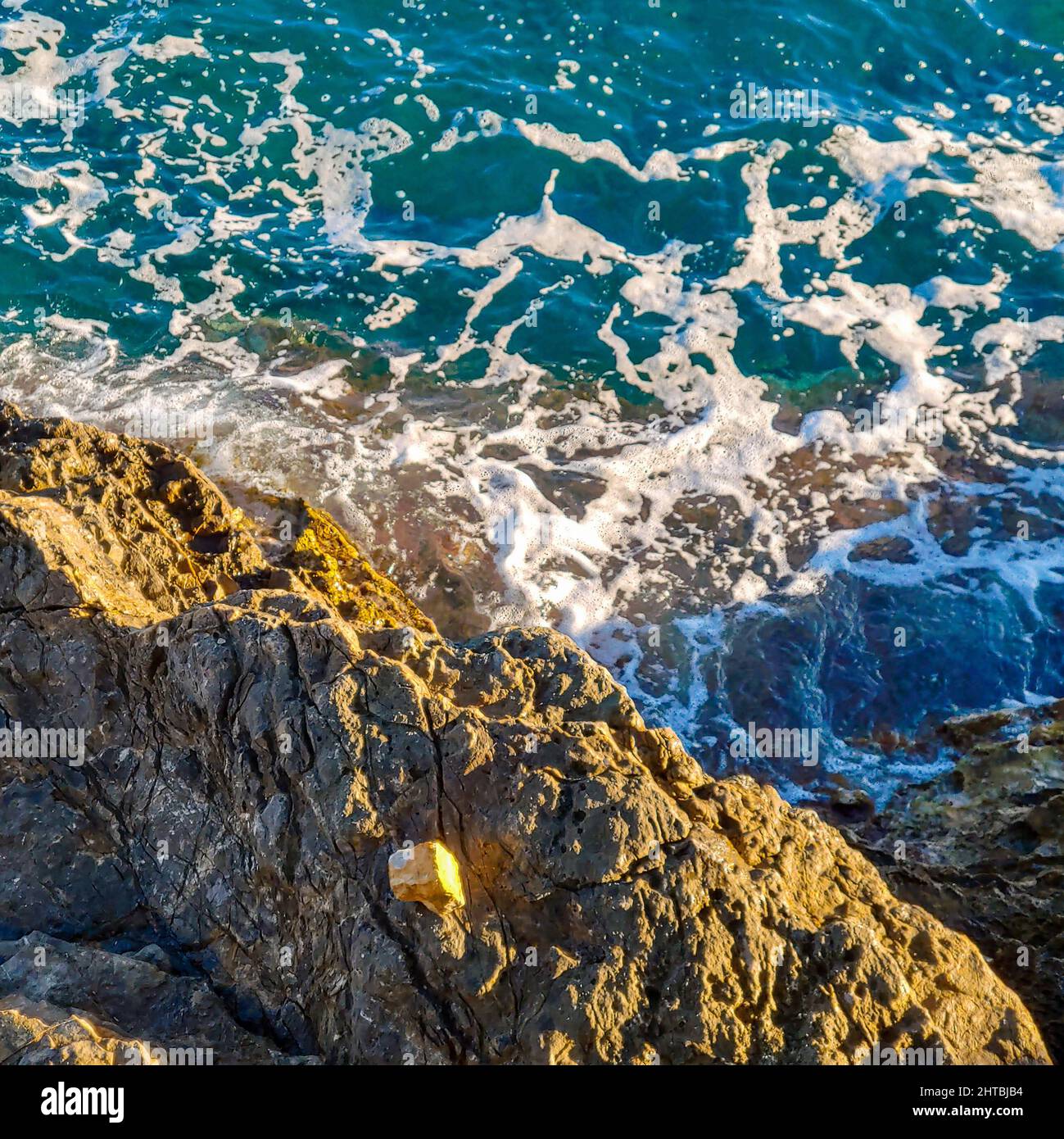 Aerial top view of tall cliffs and the wavy sea washing the shore Stock ...