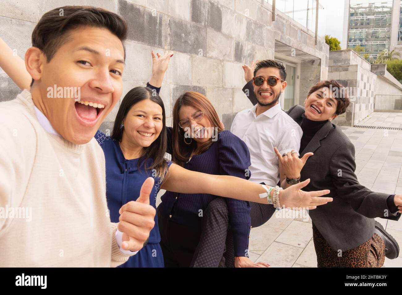 Closeup of Co-workers leaving the office chatting together Stock Photo ...