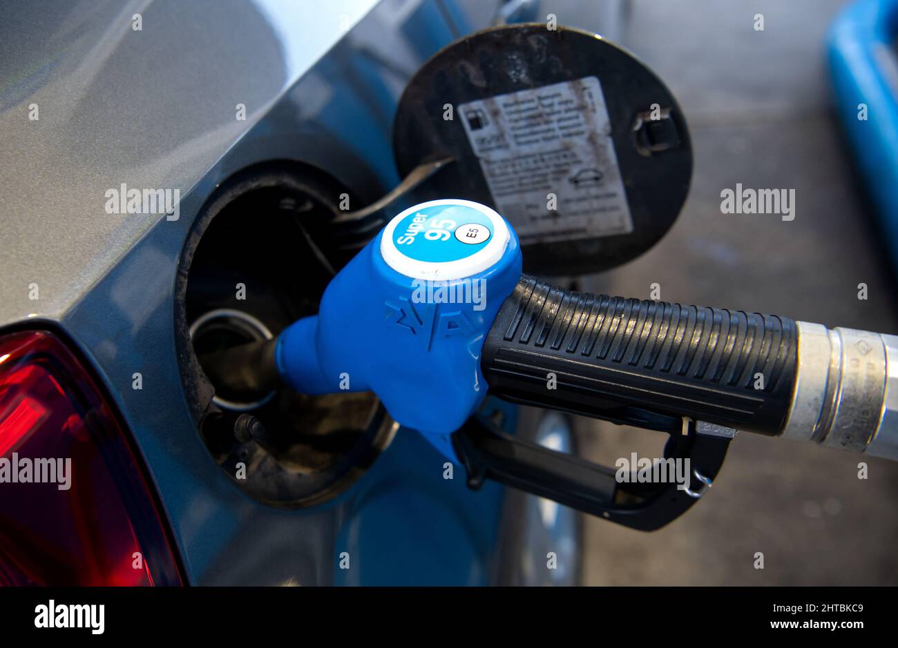 Munich, Germany. 28th Feb, 2022. A pump nozzle labeled "Super 95" is ...