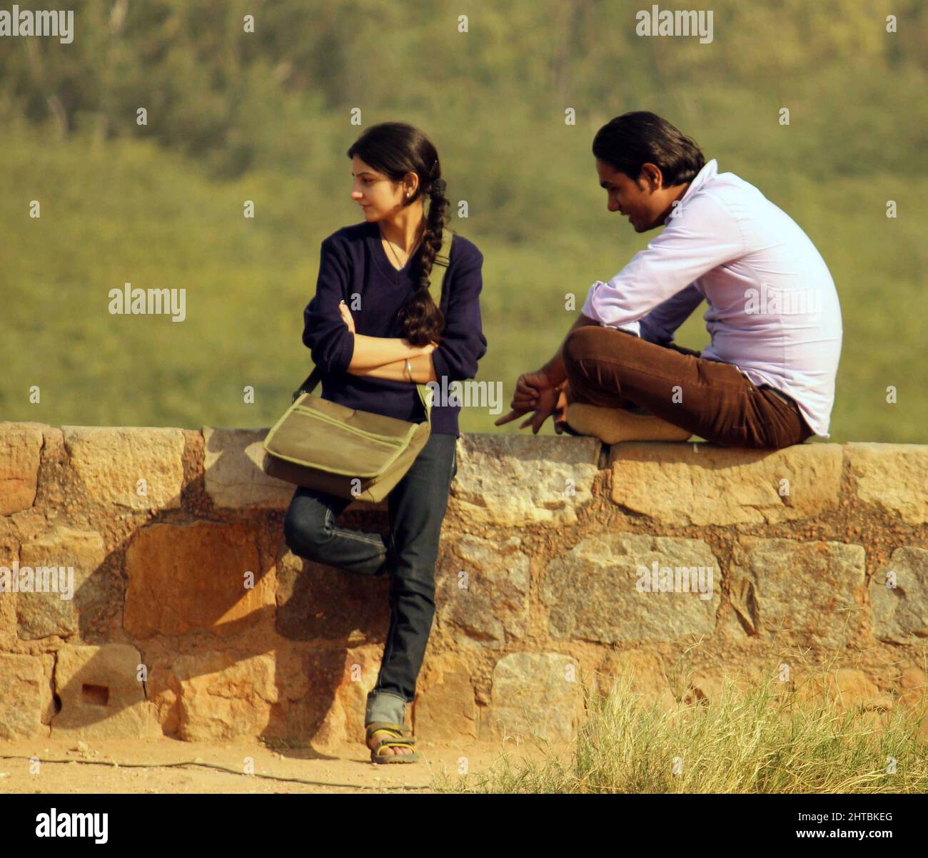 Attractive couple sitting next other hi-res stock photography and ...