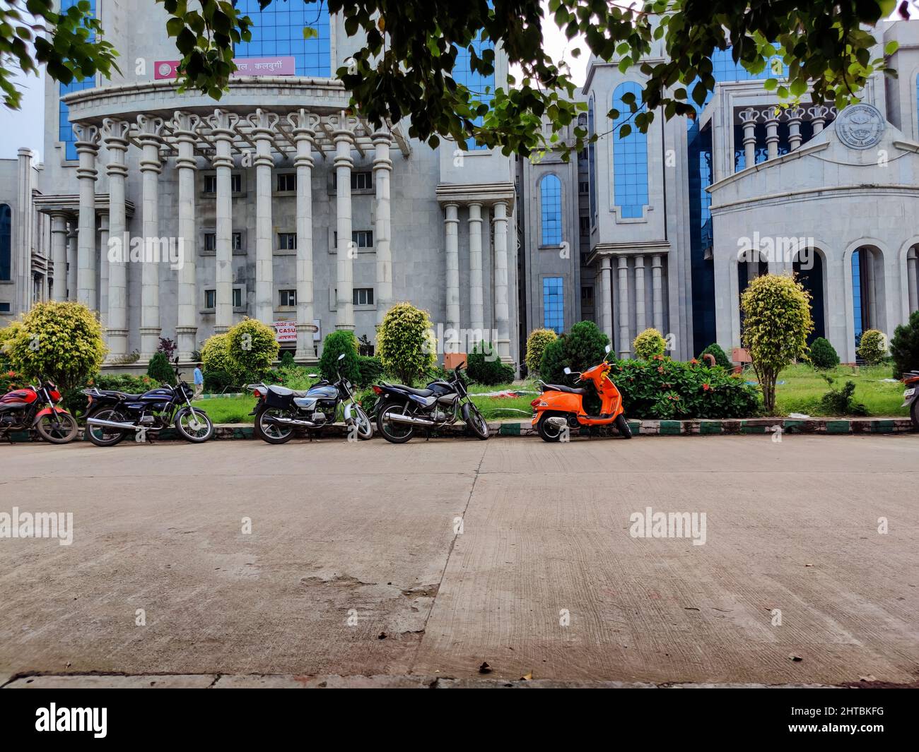 ESIC hospital and medical collage premises, vehicles parked outside of ...