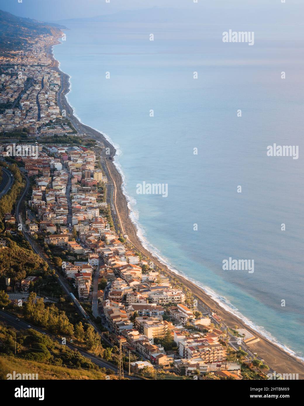 Aerial view of buildings with a Mediterranean sea in Sicily, Italy ...