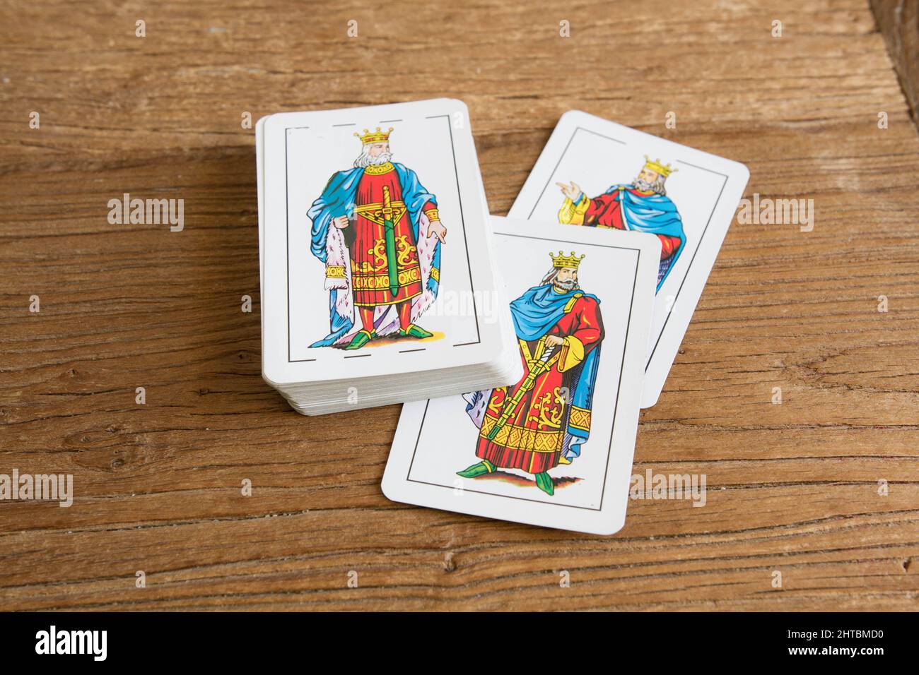 Top view of playing cards on the wooden table Stock Photo - Alamy
