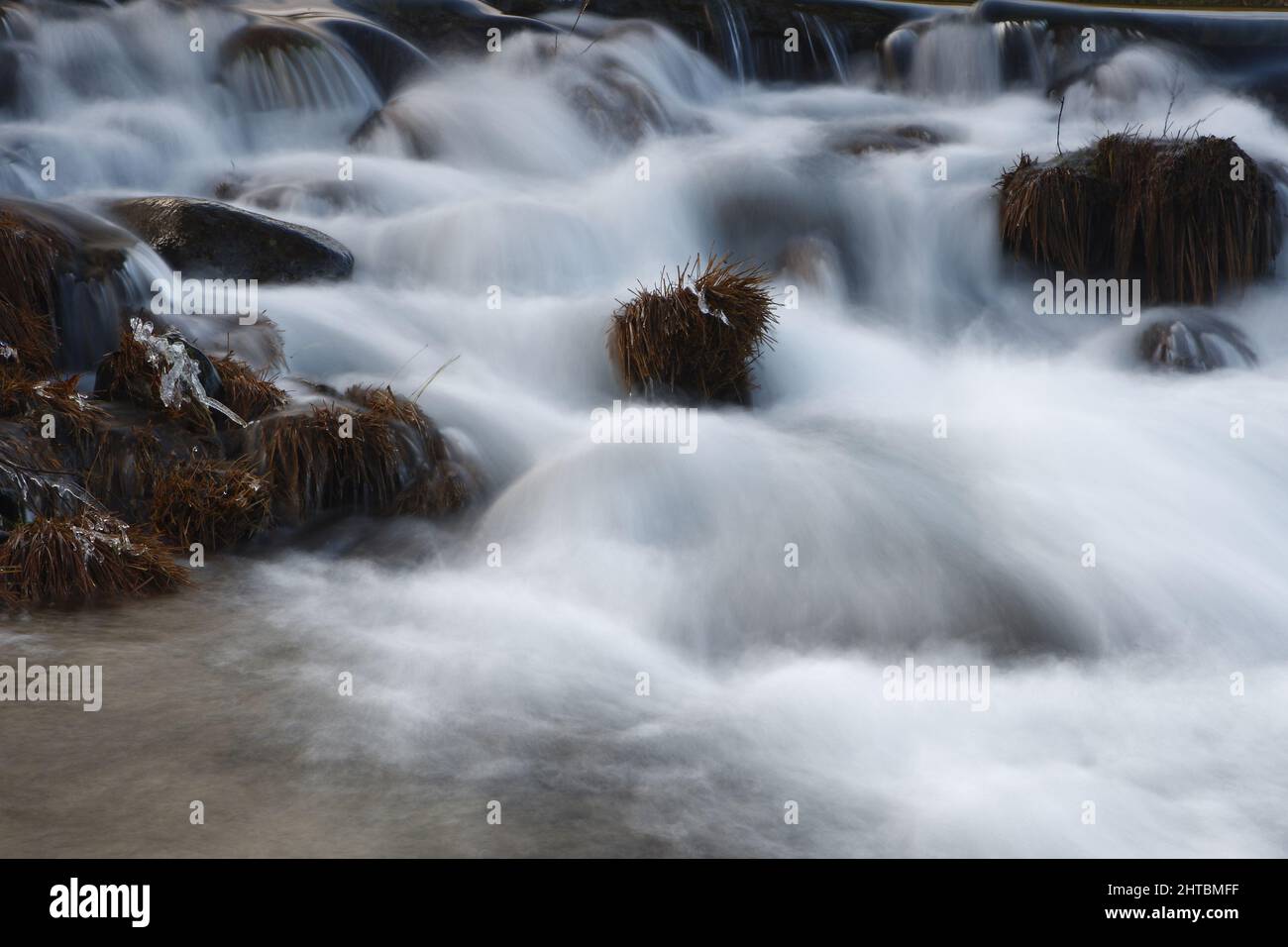 Blurry water flowing on the rock and waves splashing in the river Stock ...