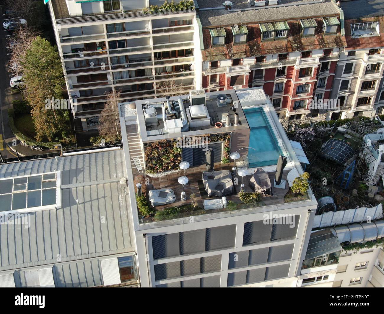 Aerial shot of a rooftop with a swimming pool on an upscale apartment ...