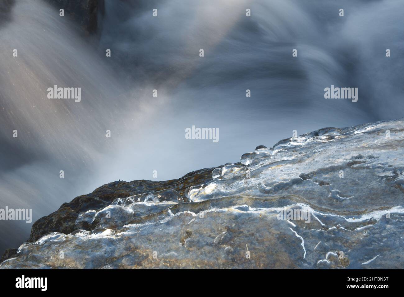 Blurry water flowing on the rock and waves splashing in the river Stock ...
