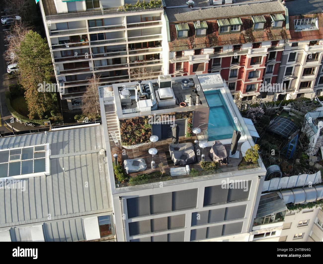 Aerial shot of an upscale apartment building with a swimming pool on ...