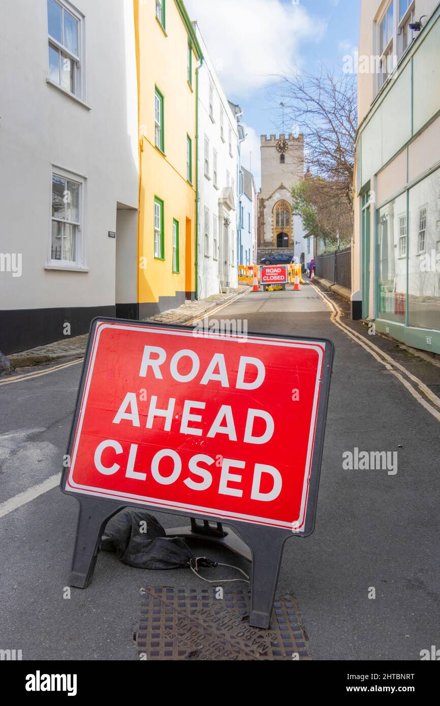 red road ahead closed traffic sign in a street in Lyme Regis Dorset ...