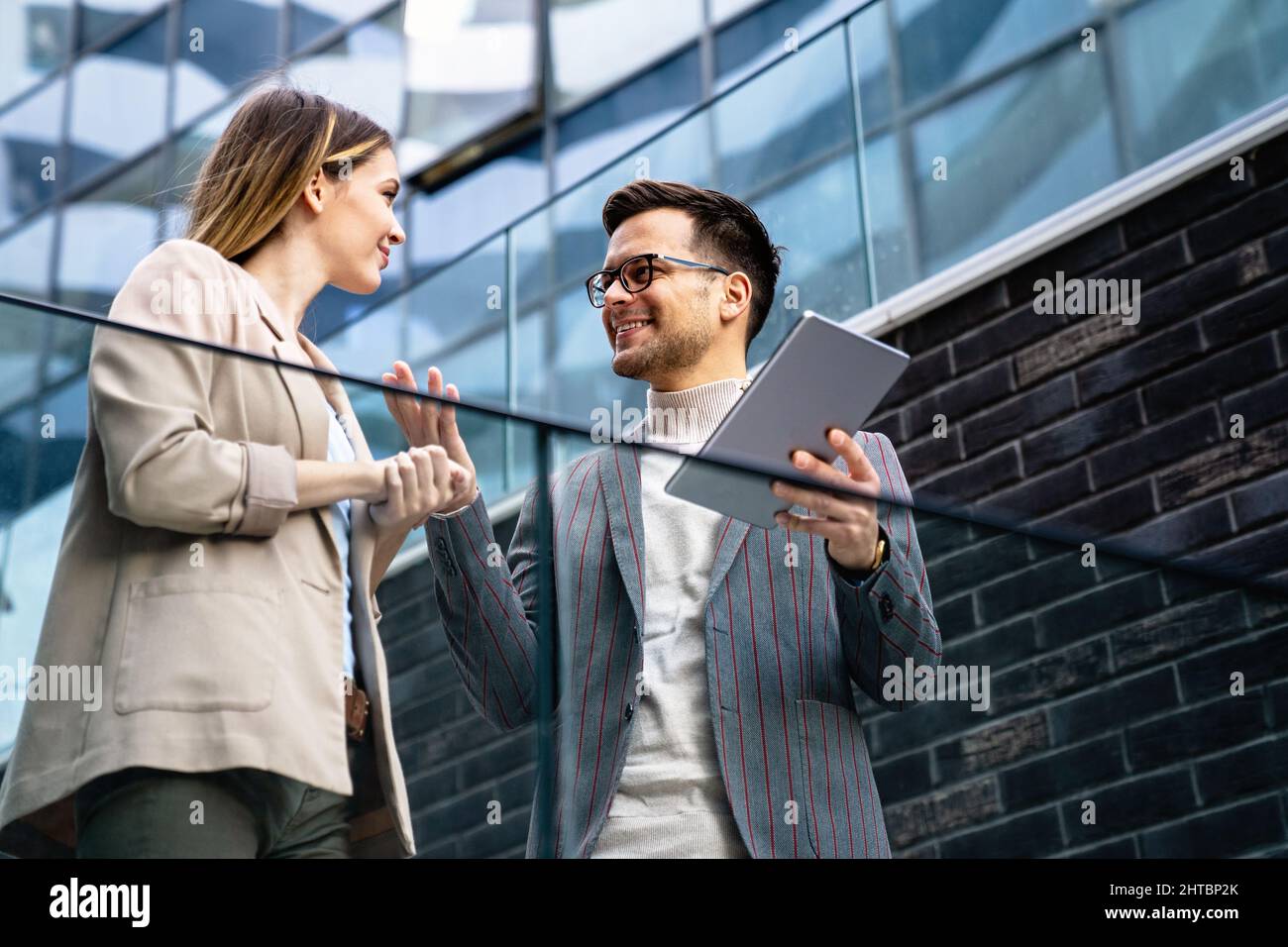 Business people having meeting outdoors hi-res stock photography and ...