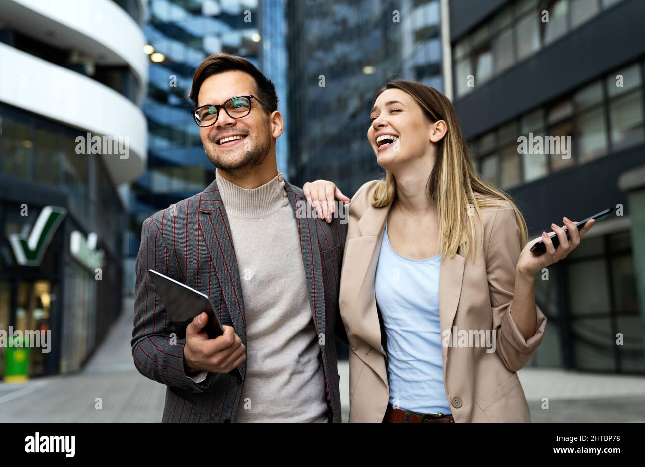 Successful group of designers, business people at work in the city ...