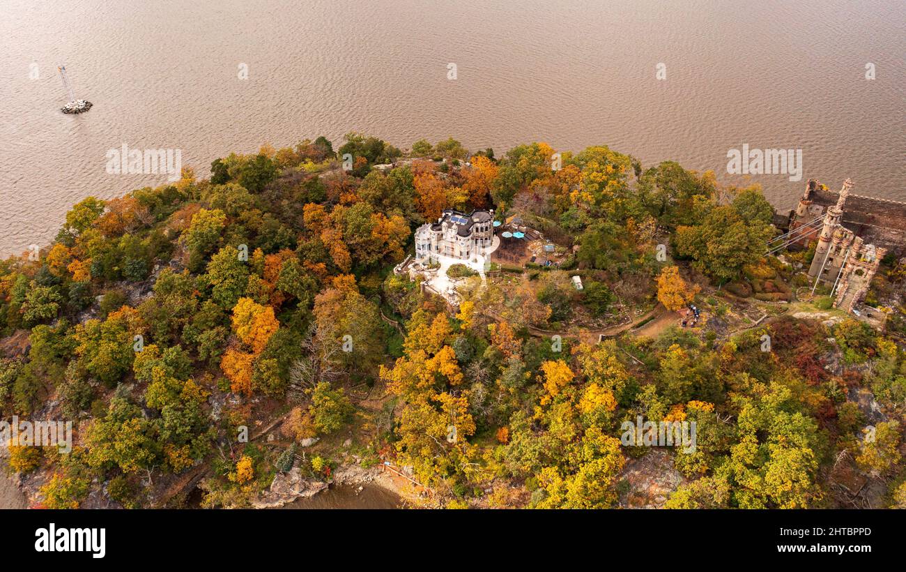 Aerial view of Bannerman's Castle surrounded by lush autumnal foliage ...