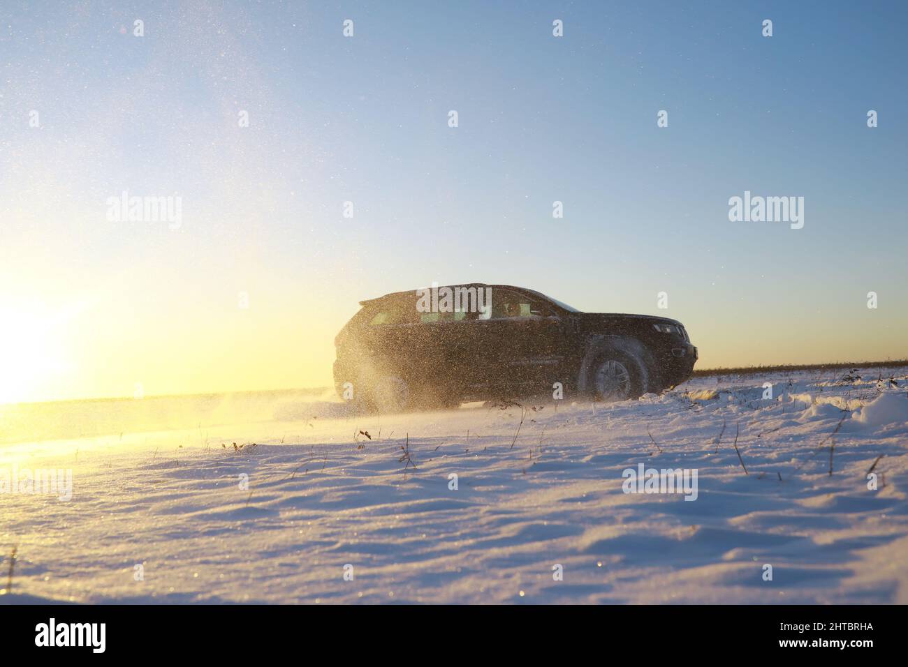 Car in the field winter. Off-road winter snow drifts. Extreme sport ...