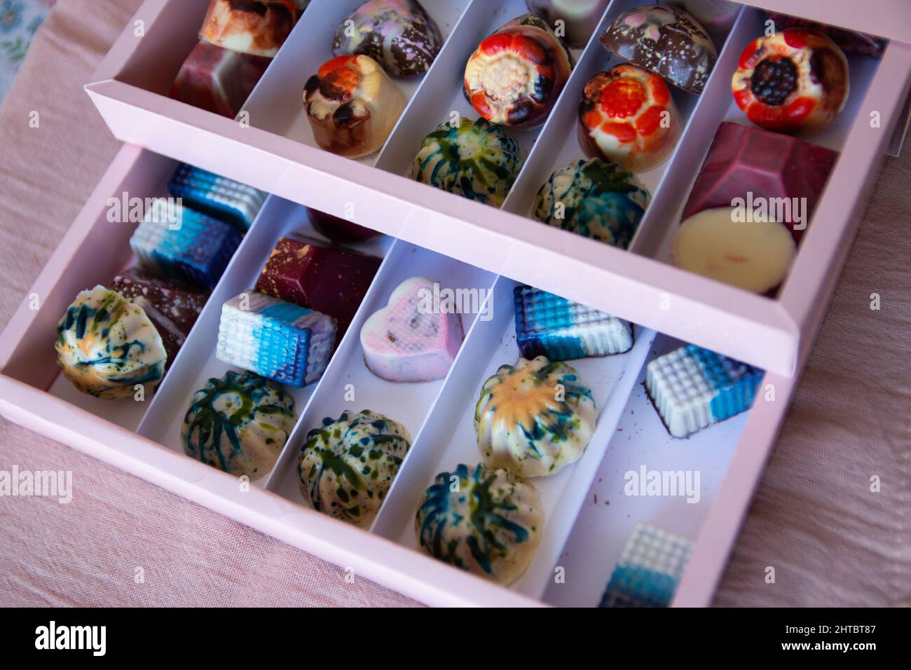 Closeup shot of a chocolate box with chocolates of different flavors ...
