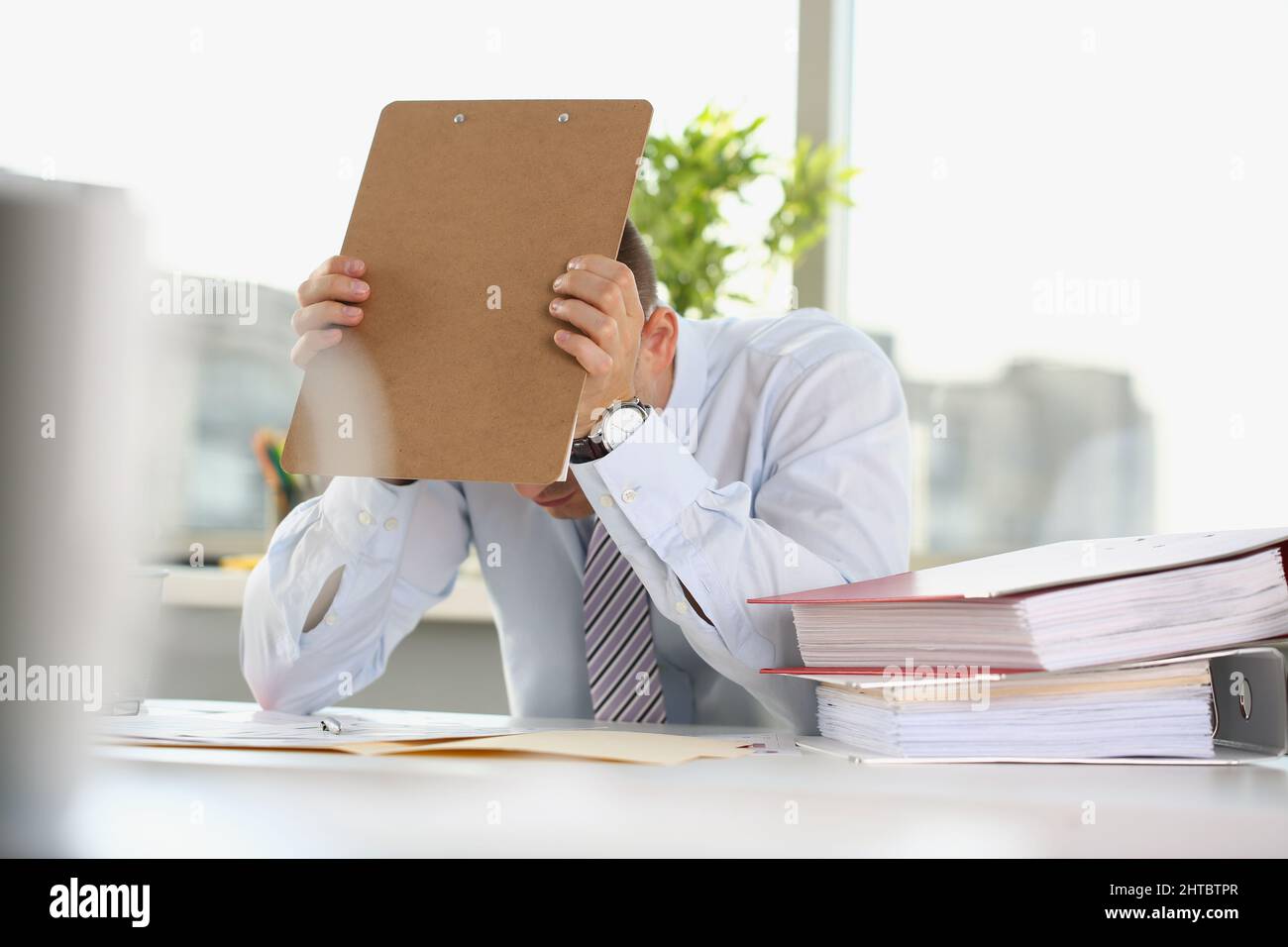 Male employee overworked desk hi-res stock photography and images - Alamy