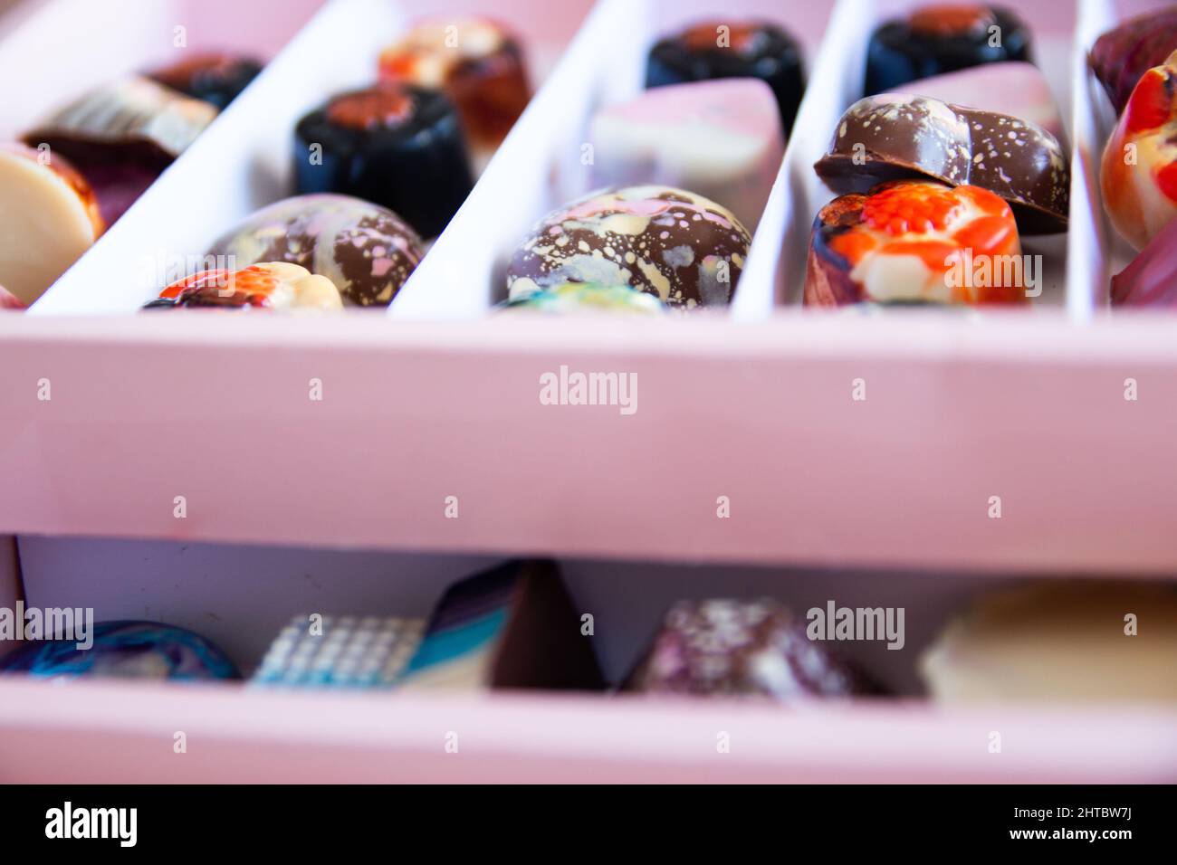 Closeup shot of a chocolate box with chocolates of different flavors ...