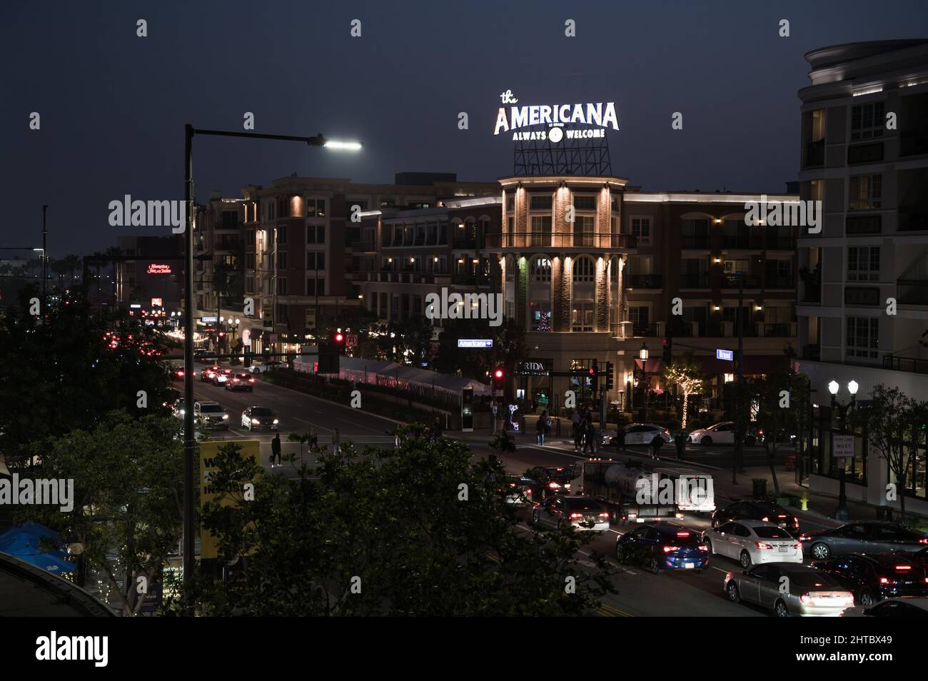 Americana sign on a building at night in the streets full of cars Stock ...
