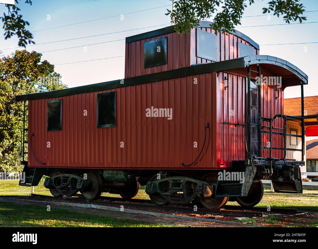 Old goods wagon in a park Stock Photo - Alamy