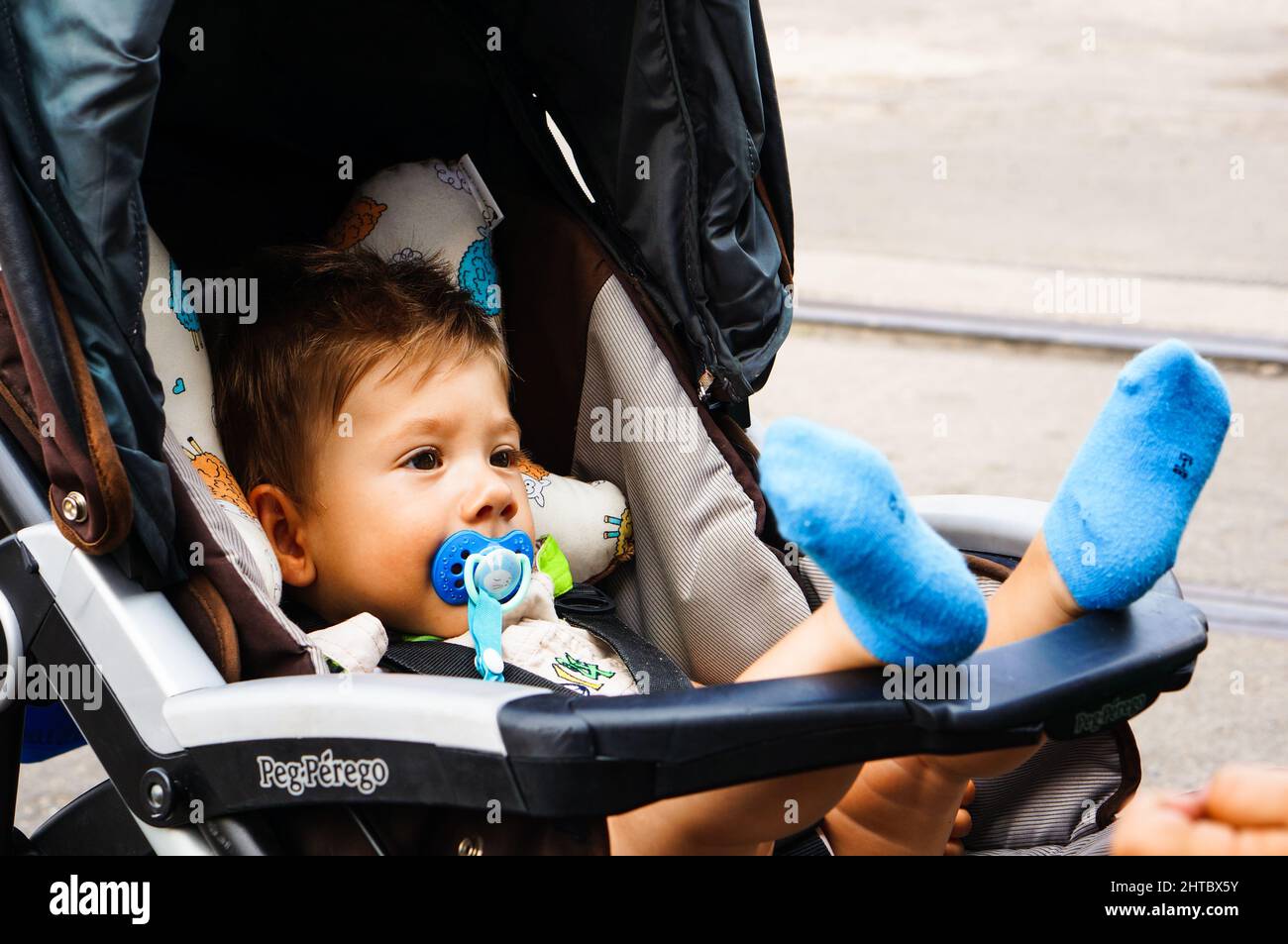 Cute baby boy in a buggy at an outdoor museum Stock Photo - Alamy