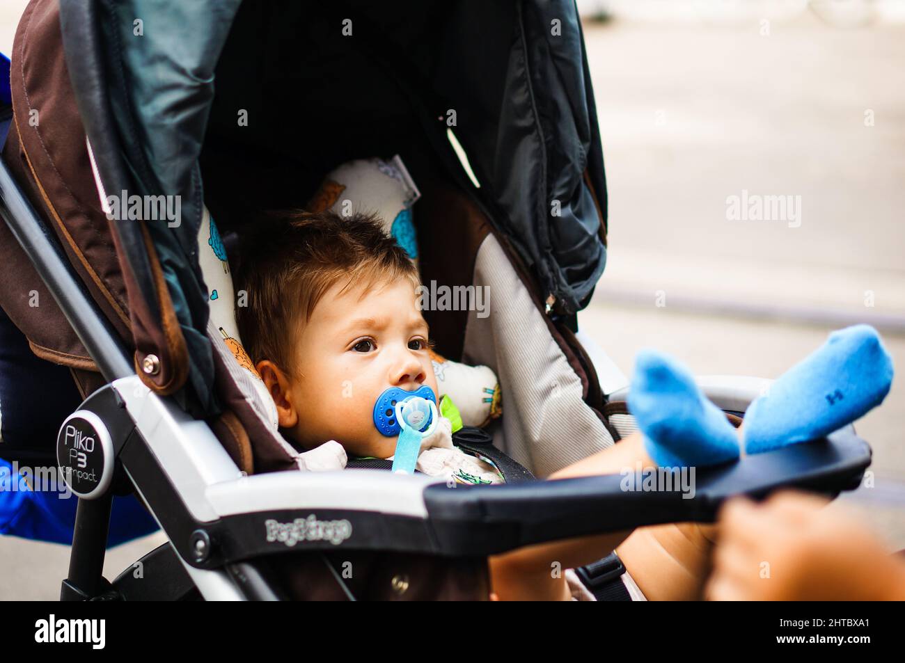 Cute baby boy in a buggy at an outdoor museum Stock Photo - Alamy