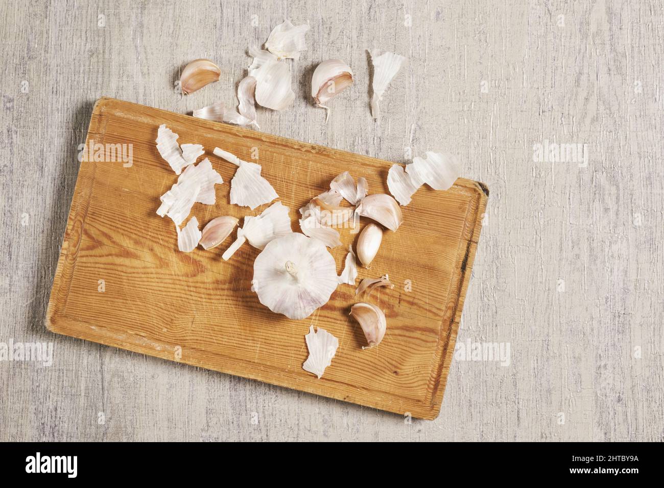 Top view of the cleaning organic garlic on the cutting board in the ...