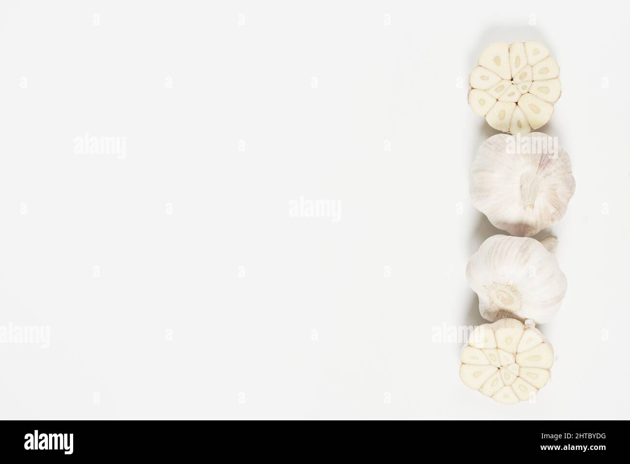 Garlic isolated on a white background with copy space Stock Photo - Alamy