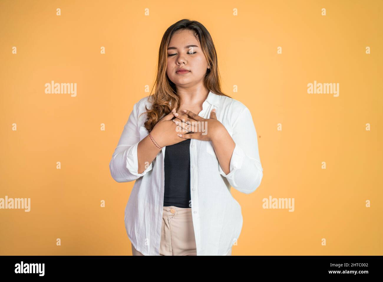 asian woman with cute hand gesture making v shape on finger Stock Photo ...