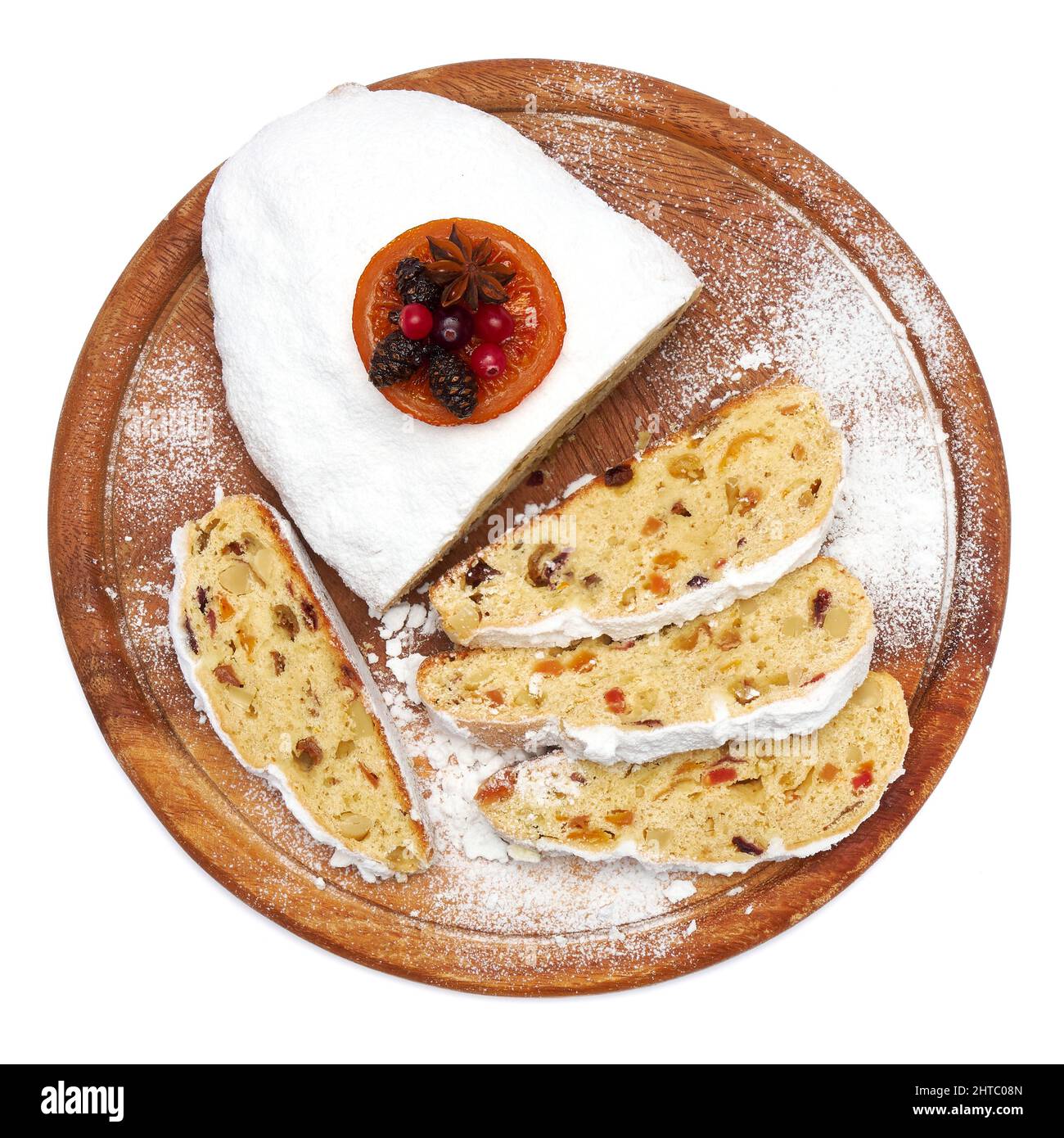 Sliced Traditional Christmas stollen cake with marzipan and dried fruit ...
