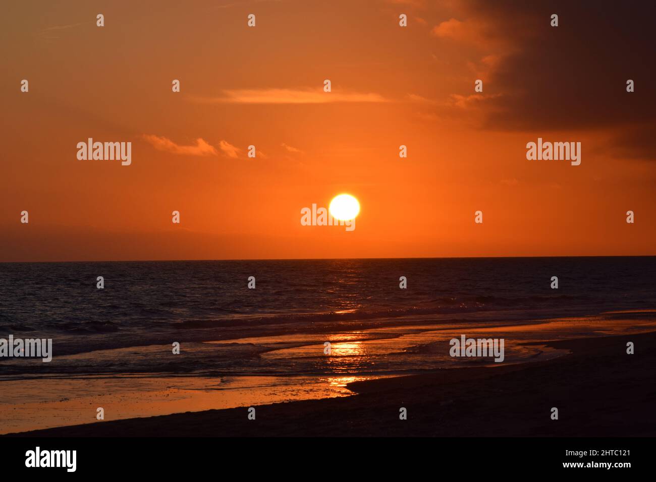Beautiful sunset with clear sky captured from a sandy sea shore Stock ...