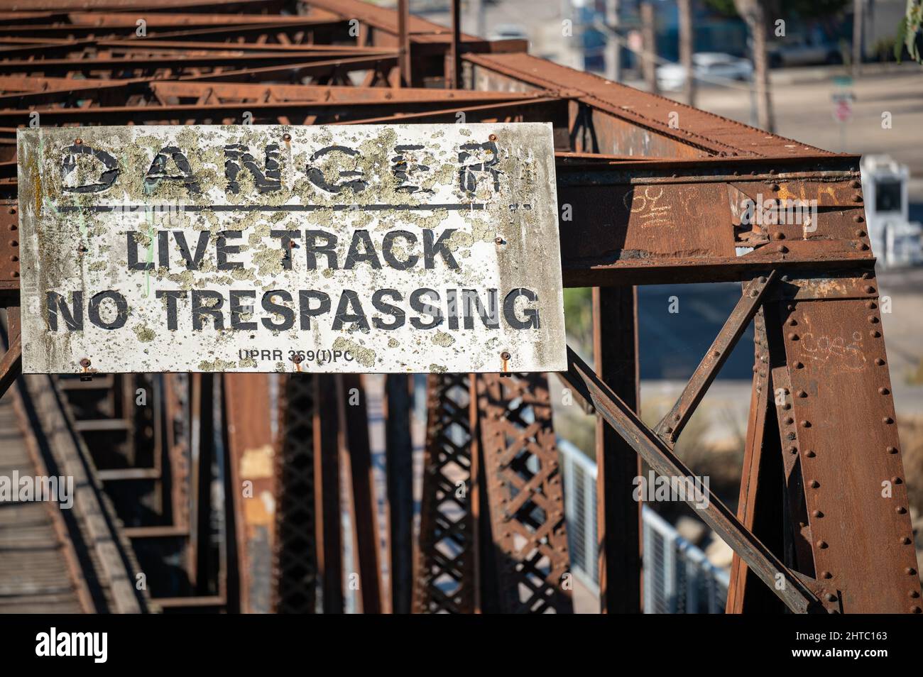 Closeup shot of a rusty warning sign of a railroad Stock Photo - Alamy