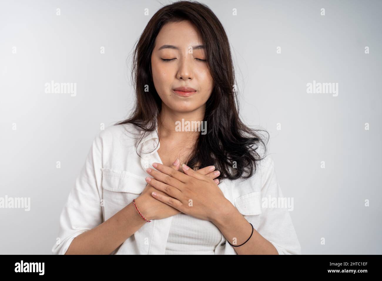 asian woman with cute hand gesture making v shape on finger Stock Photo ...