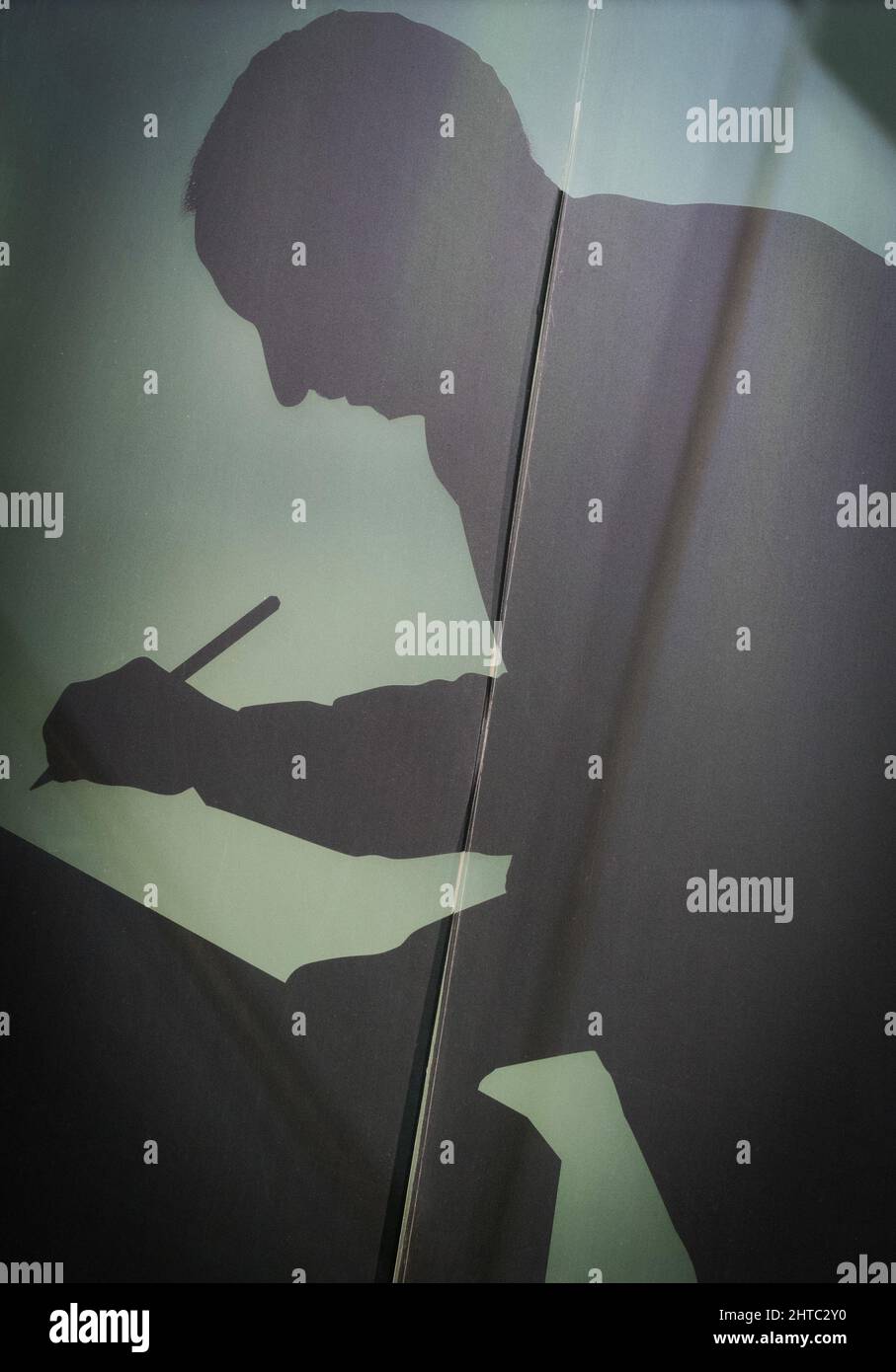 Silhouette of a writing man Stock Photo - Alamy