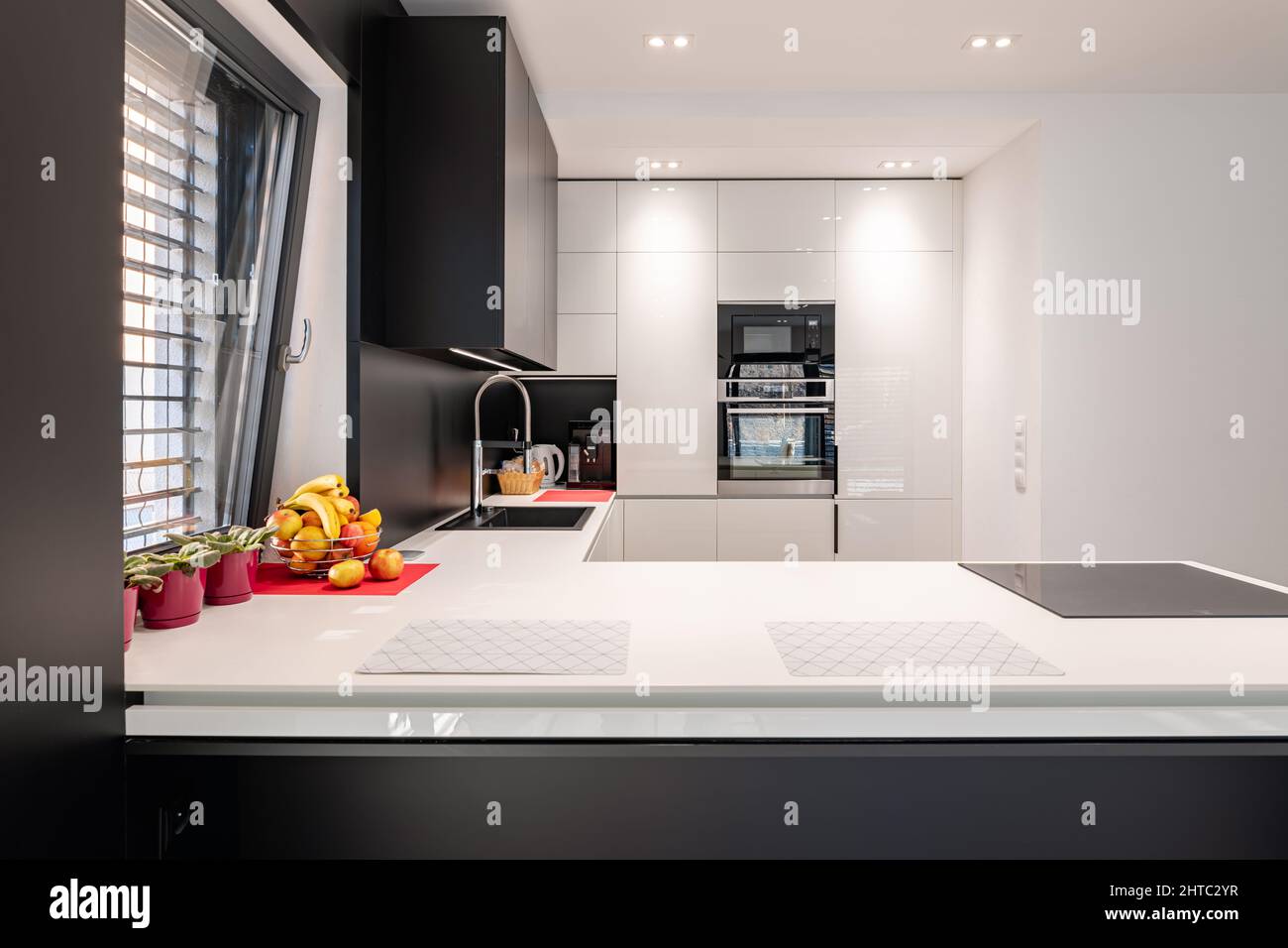 Custom fit minimalistic kitchen interior design Stock Photo - Alamy