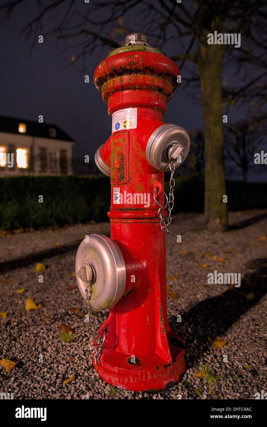 Vertical shot of a red hydrant ready for firefighters Stock Photo - Alamy