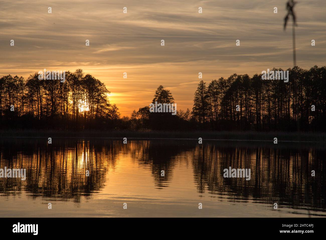 Beautiful landscape sunset view over reflecting lake water with ...