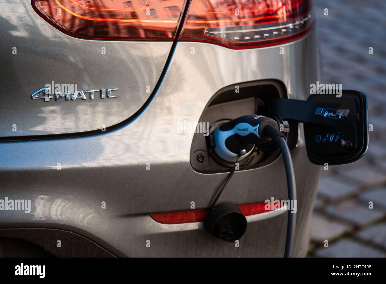 Detail closeup of the charger Merzedes Benz electric car at the station ...