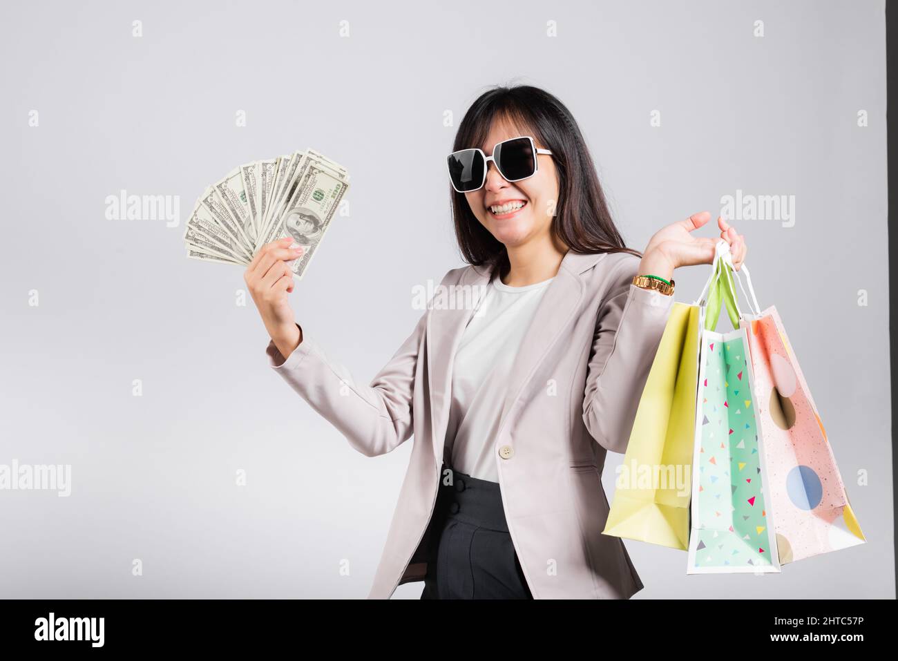 Woman with glasses confident shopper smile holding online shopping bags ...
