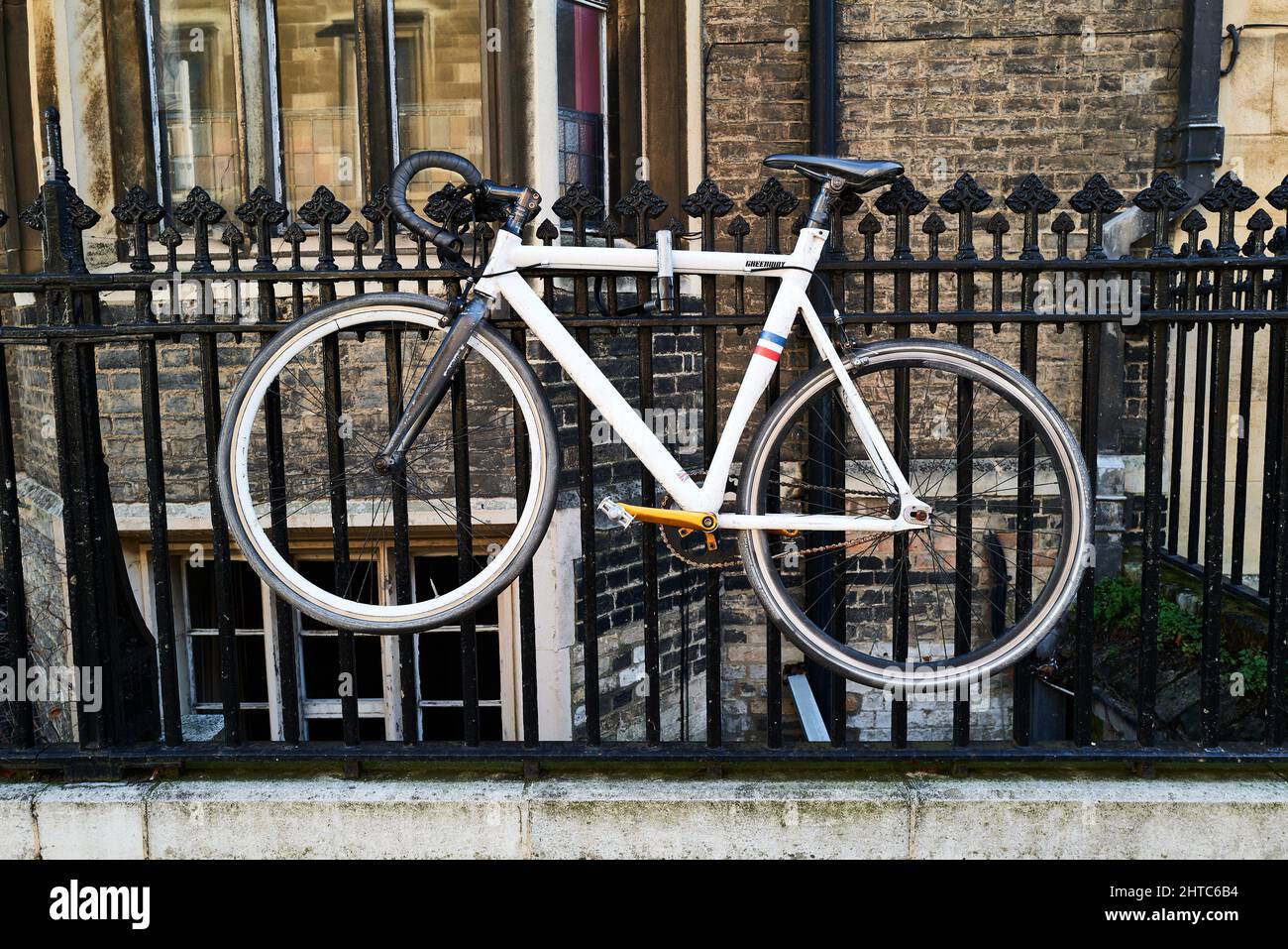 A bicycle chained to railings, Cambridge, England Stock Photo - Alamy