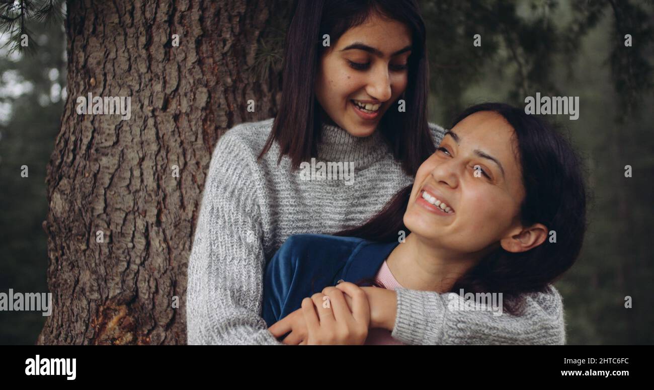 Young friends hugging smiling hi-res stock photography and images - Alamy