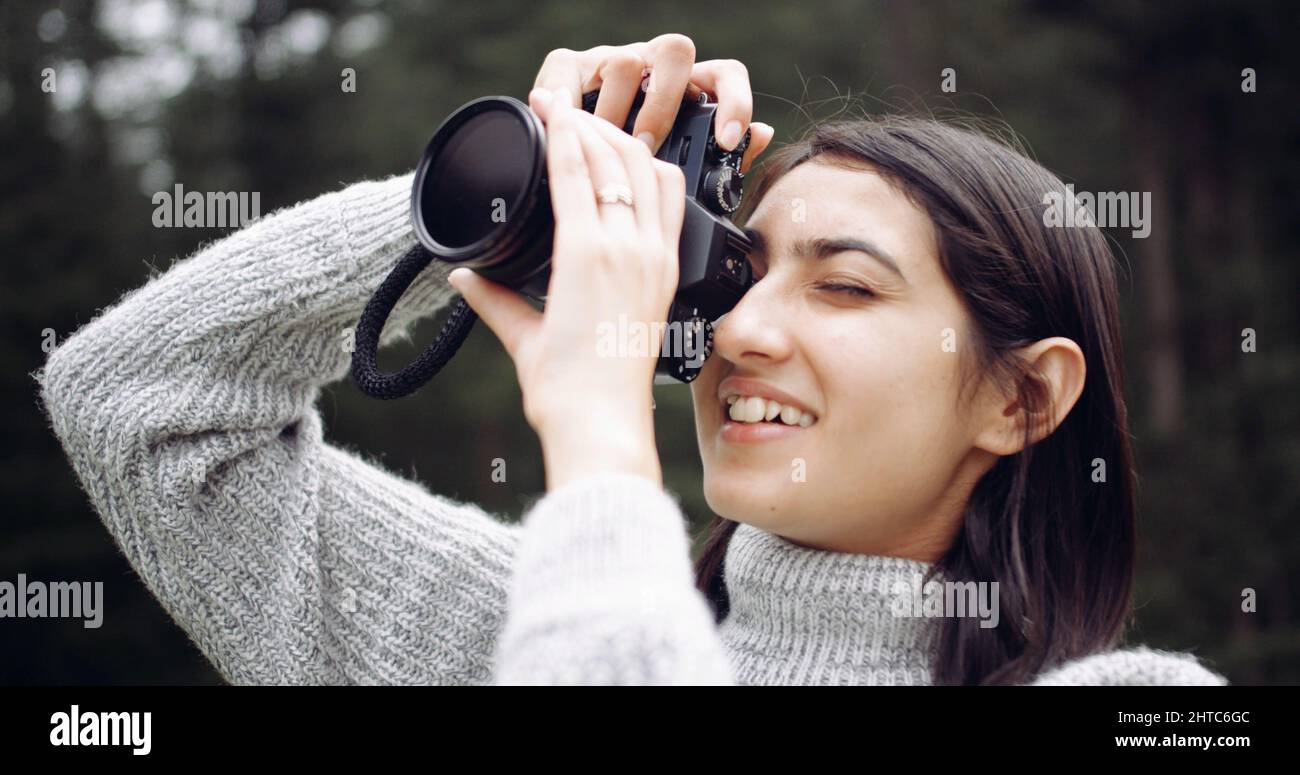 Indian woman taking photos with a camera in the forest Stock Photo - Alamy