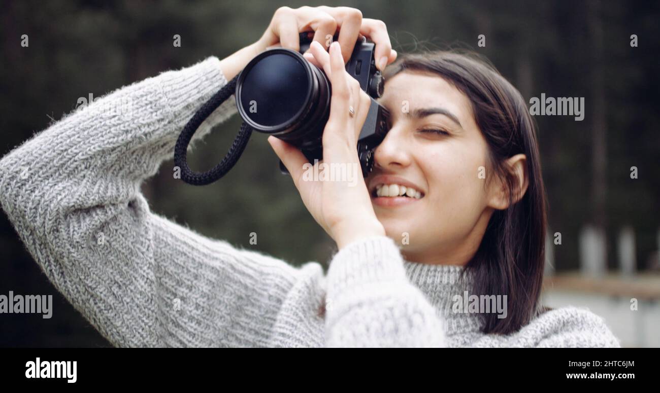 Indian woman taking photos with a camera in the forest Stock Photo - Alamy