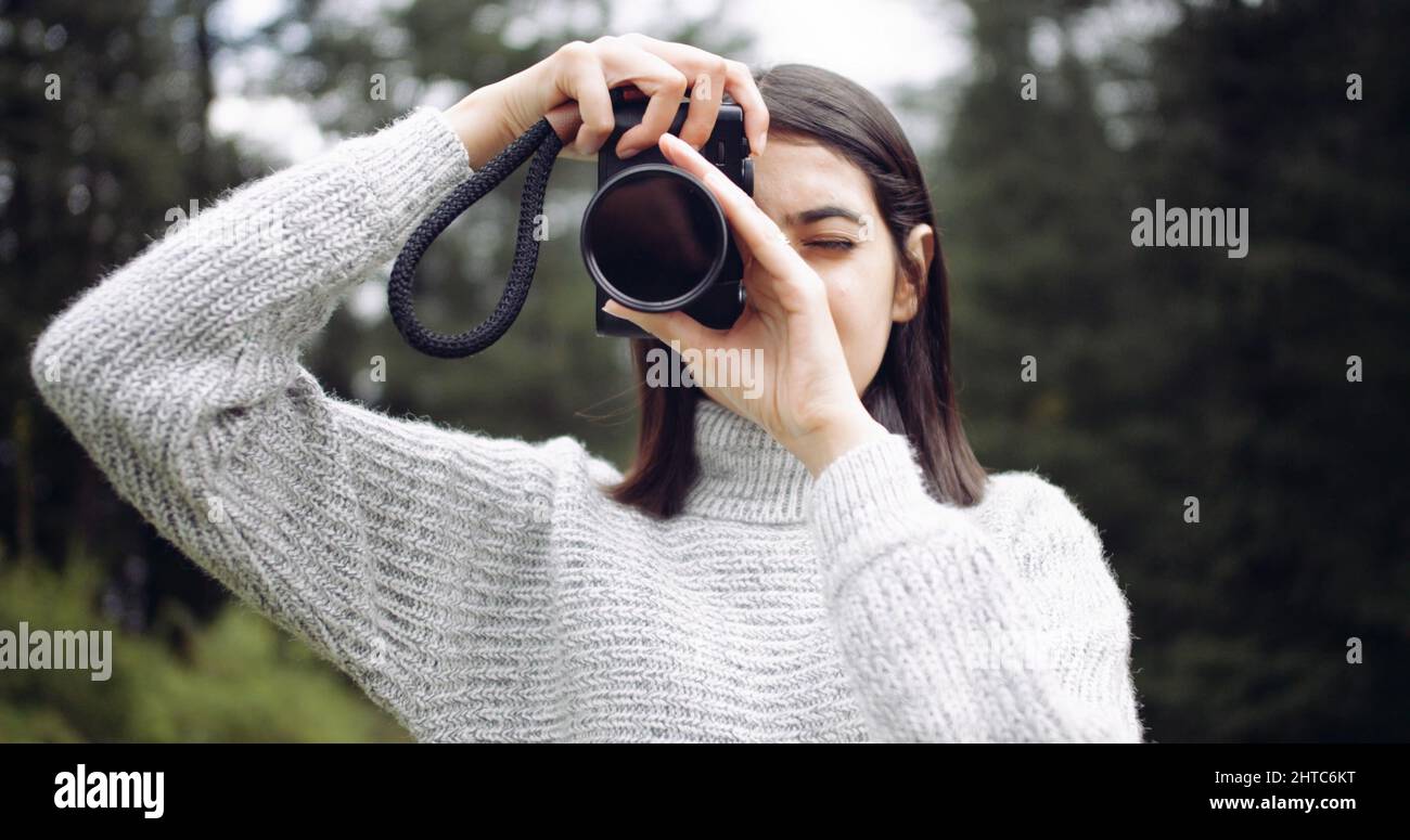 Indian woman taking photos with a camera in the forest Stock Photo - Alamy