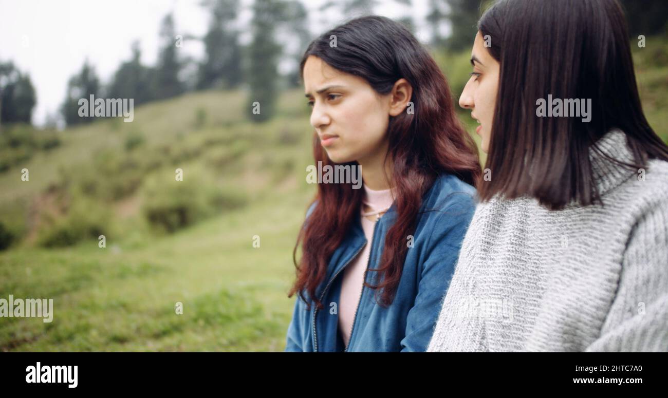 Young friends talking in the forest during the daytime Stock Photo - Alamy