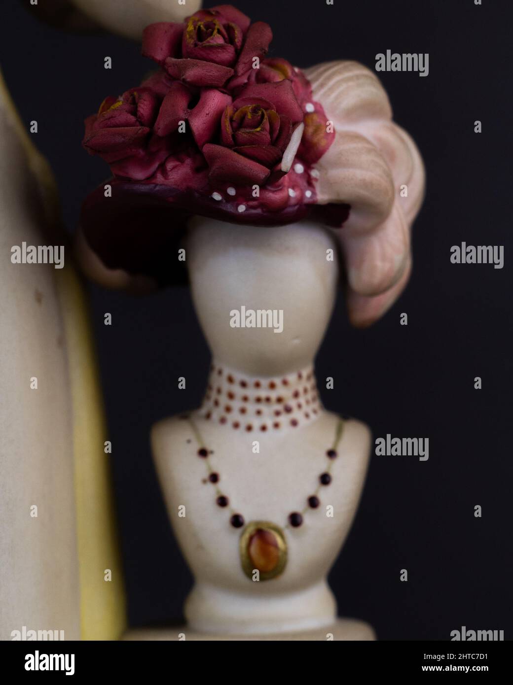 Vertical shot of a porcelain doll on a black background Stock Photo - Alamy